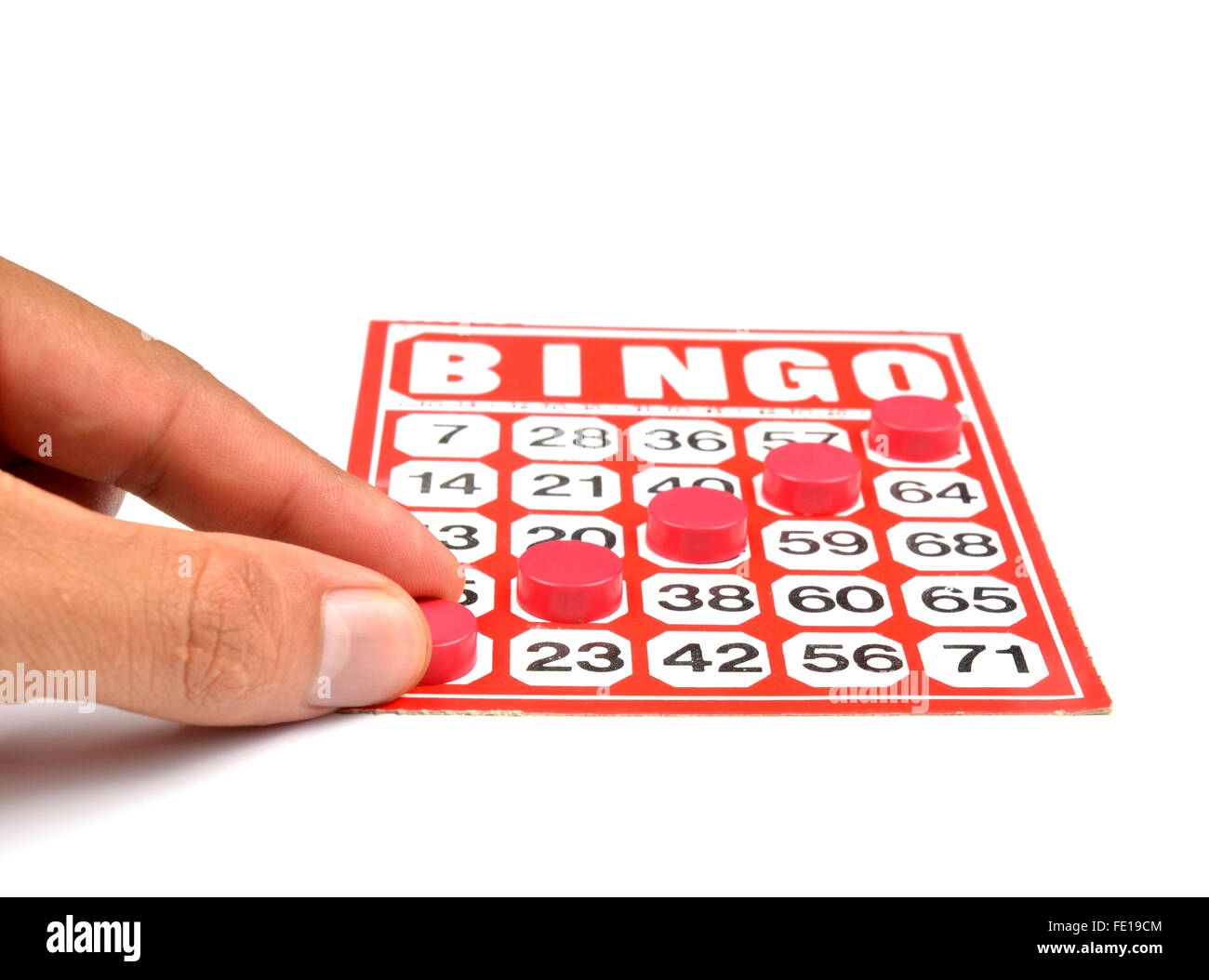 bingo card with hand hold winning chips Stock Photo - Alamy