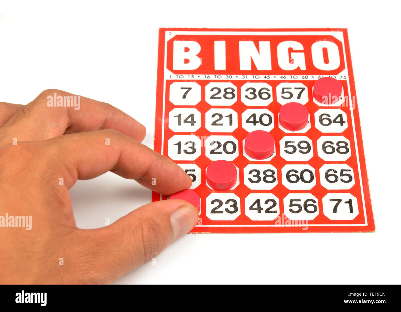 bingo card with hand hold winning chips Stock Photo - Alamy