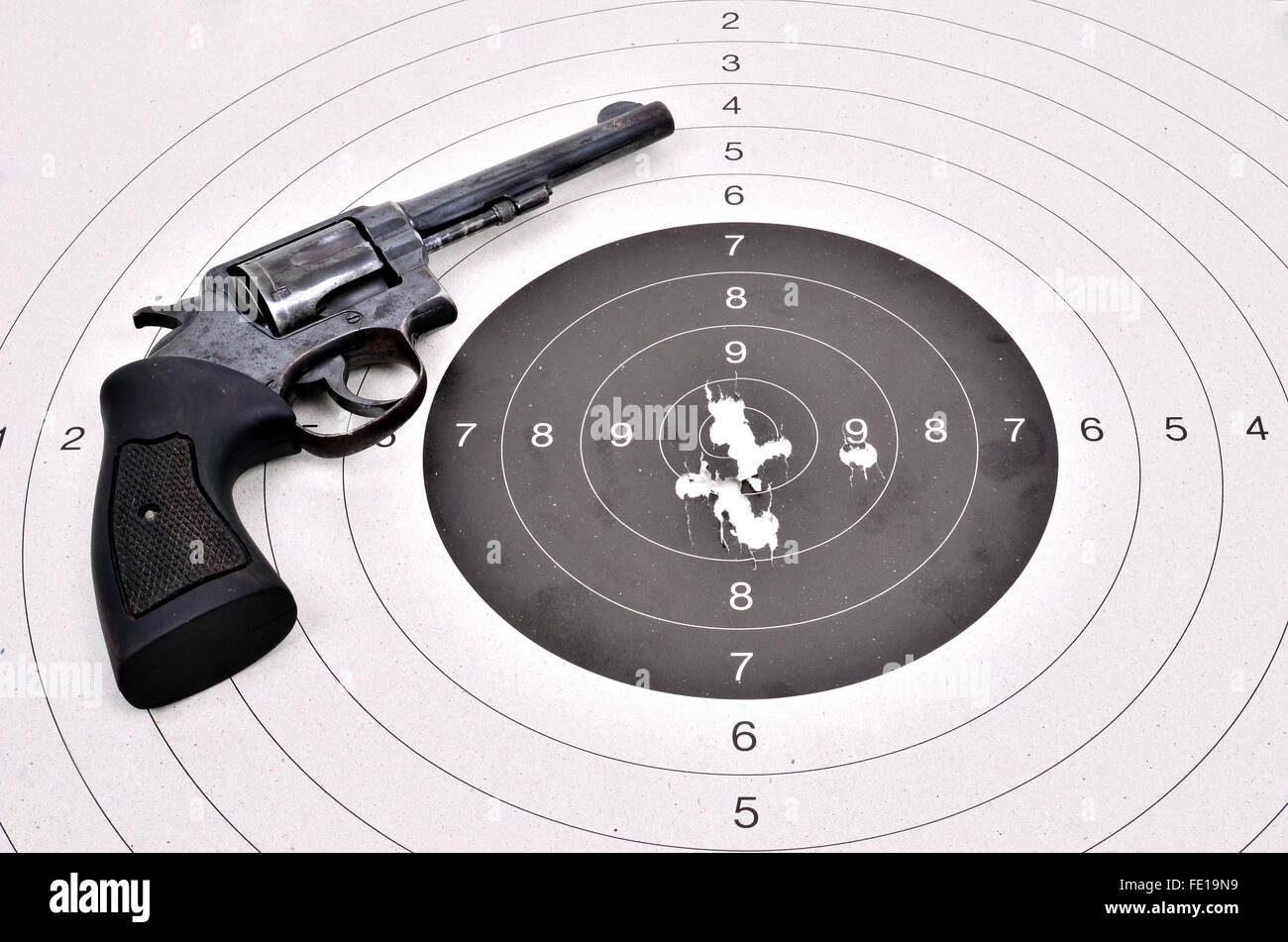 old revolver gun on the target Stock Photo - Alamy