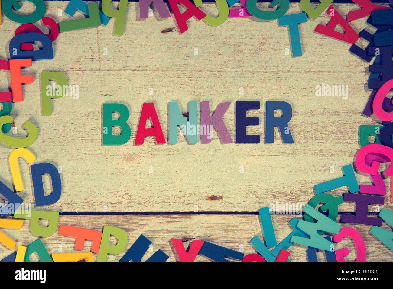 banker word block concept photo on plank wood Stock Photo - Alamy