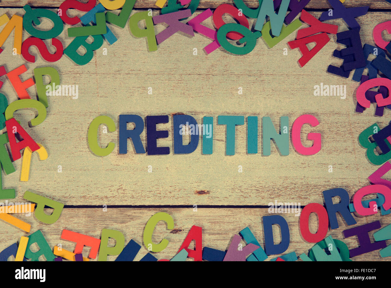 crediting word block concept photo on plank wood Stock Photo - Alamy