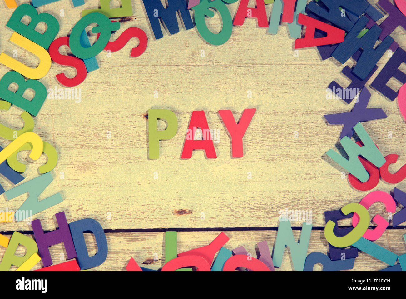 pay word block concept photo on plank wood Stock Photo - Alamy