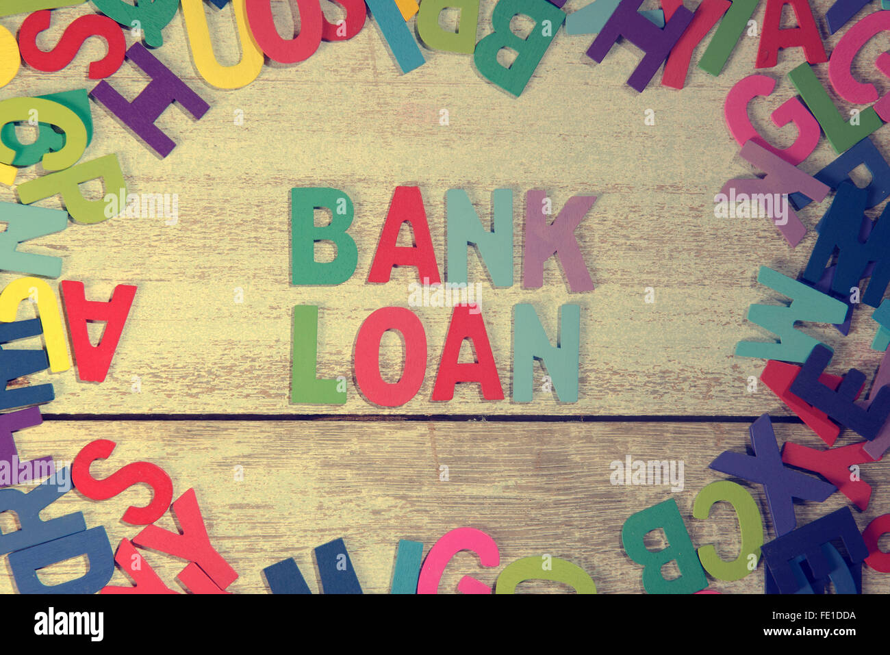 bank loan word block concept photo on plank wood Stock Photo - Alamy