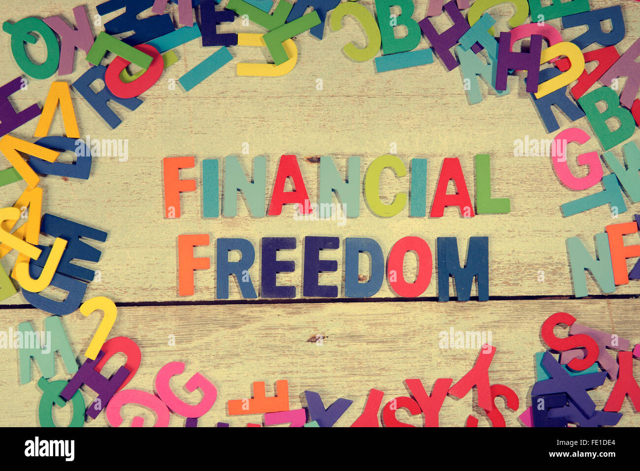 financial freedom word block concept photo on plank wood Stock Photo ...