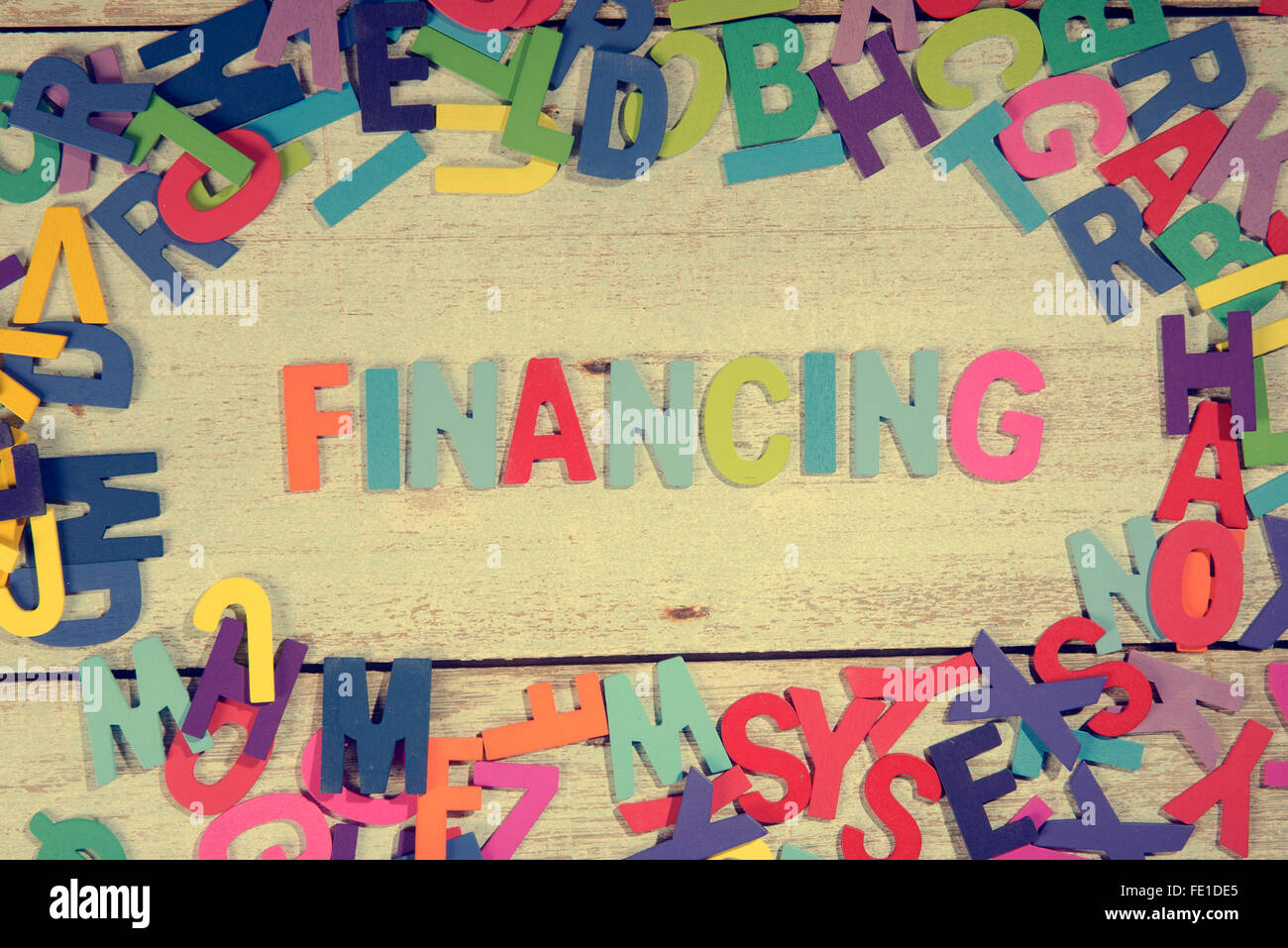 financing word block concept photo on plank wood Stock Photo - Alamy