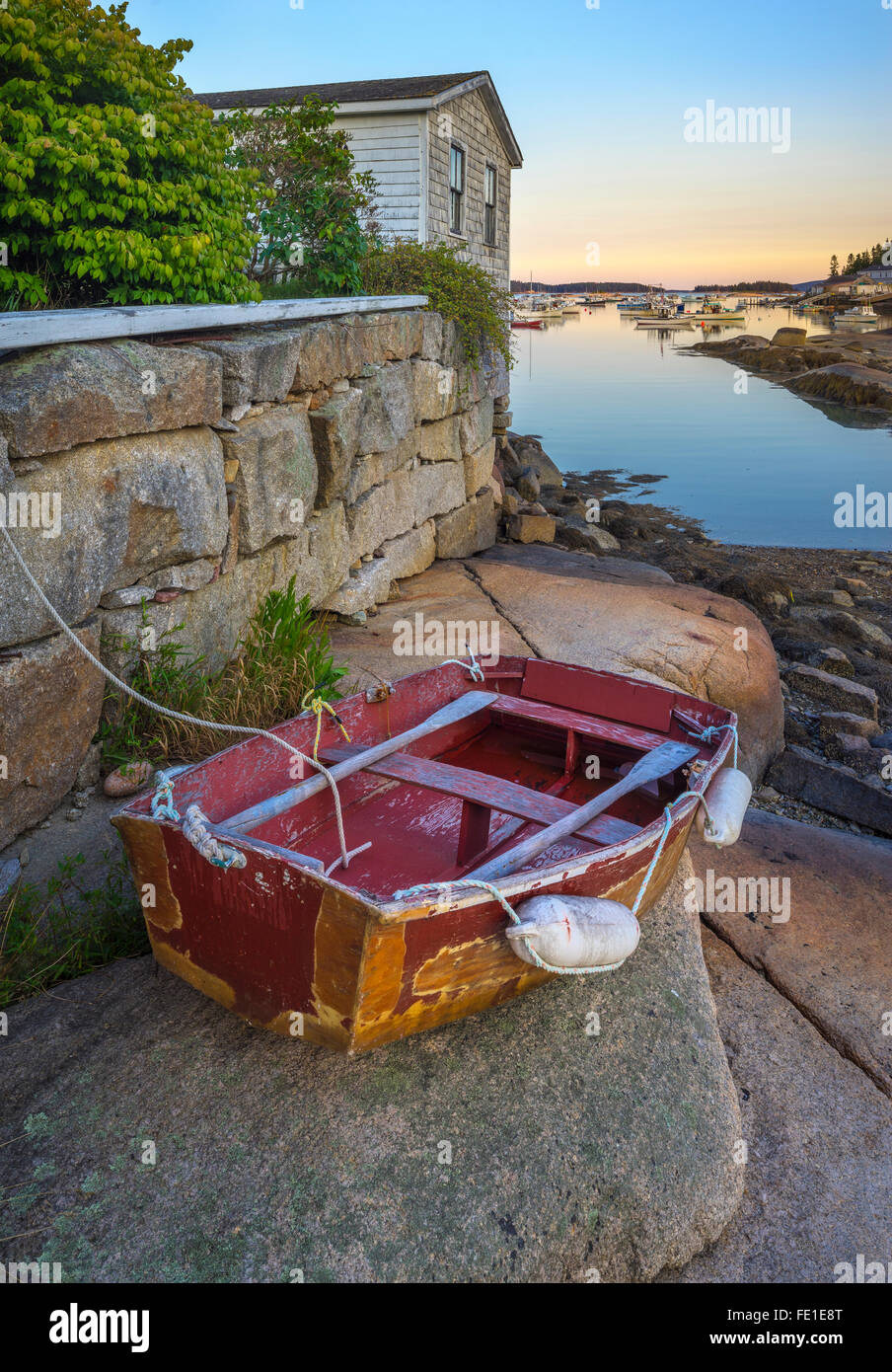 Stonington; Maine:; Wooden rowing pram on a rock shelf at low tide ...