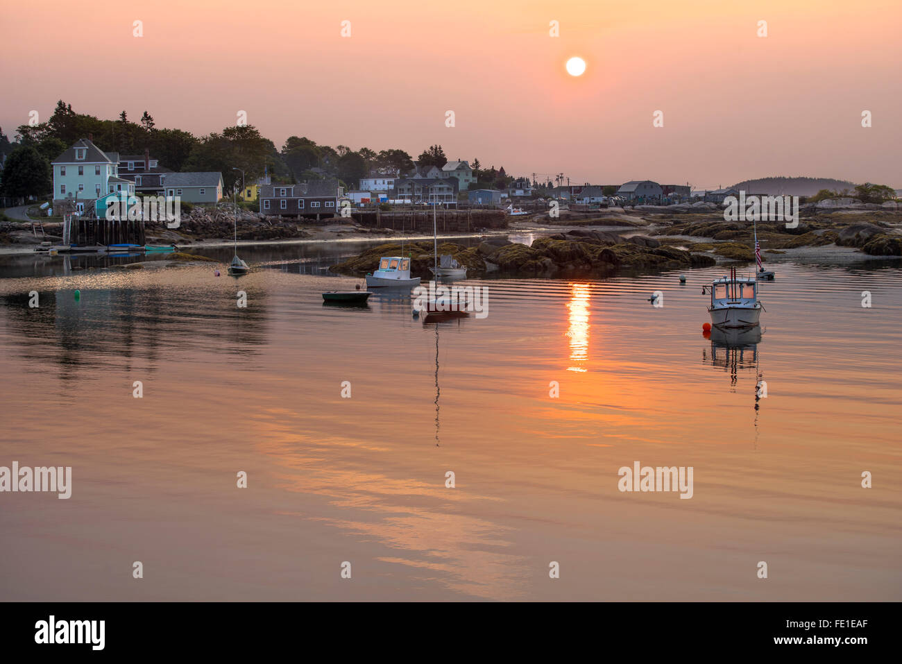 Stonington, Maine: Stonington Harbor reflections at sunrise Stock Photo ...
