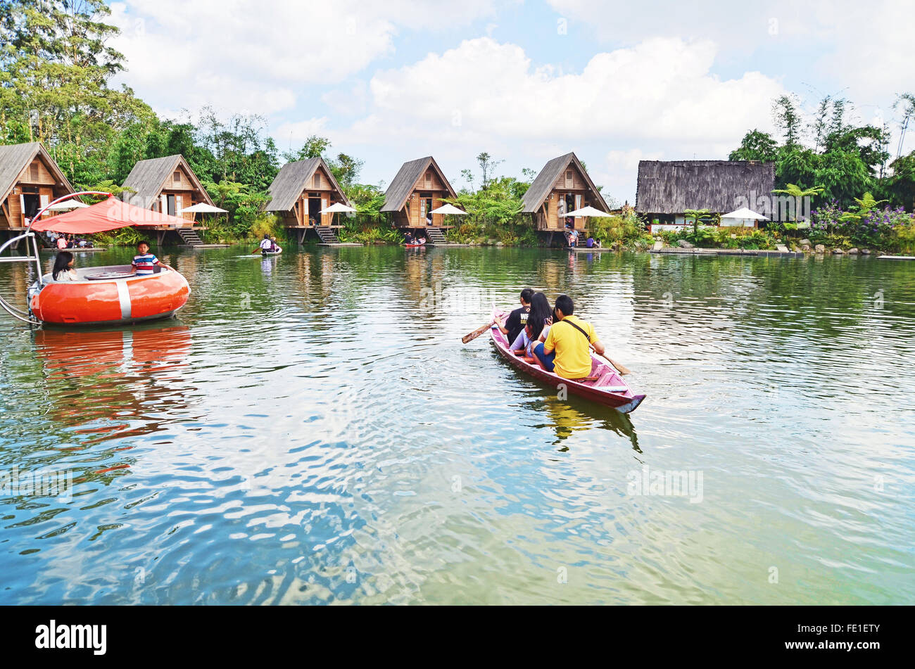 Water cottage and a boat on the lake Stock Photo - Alamy