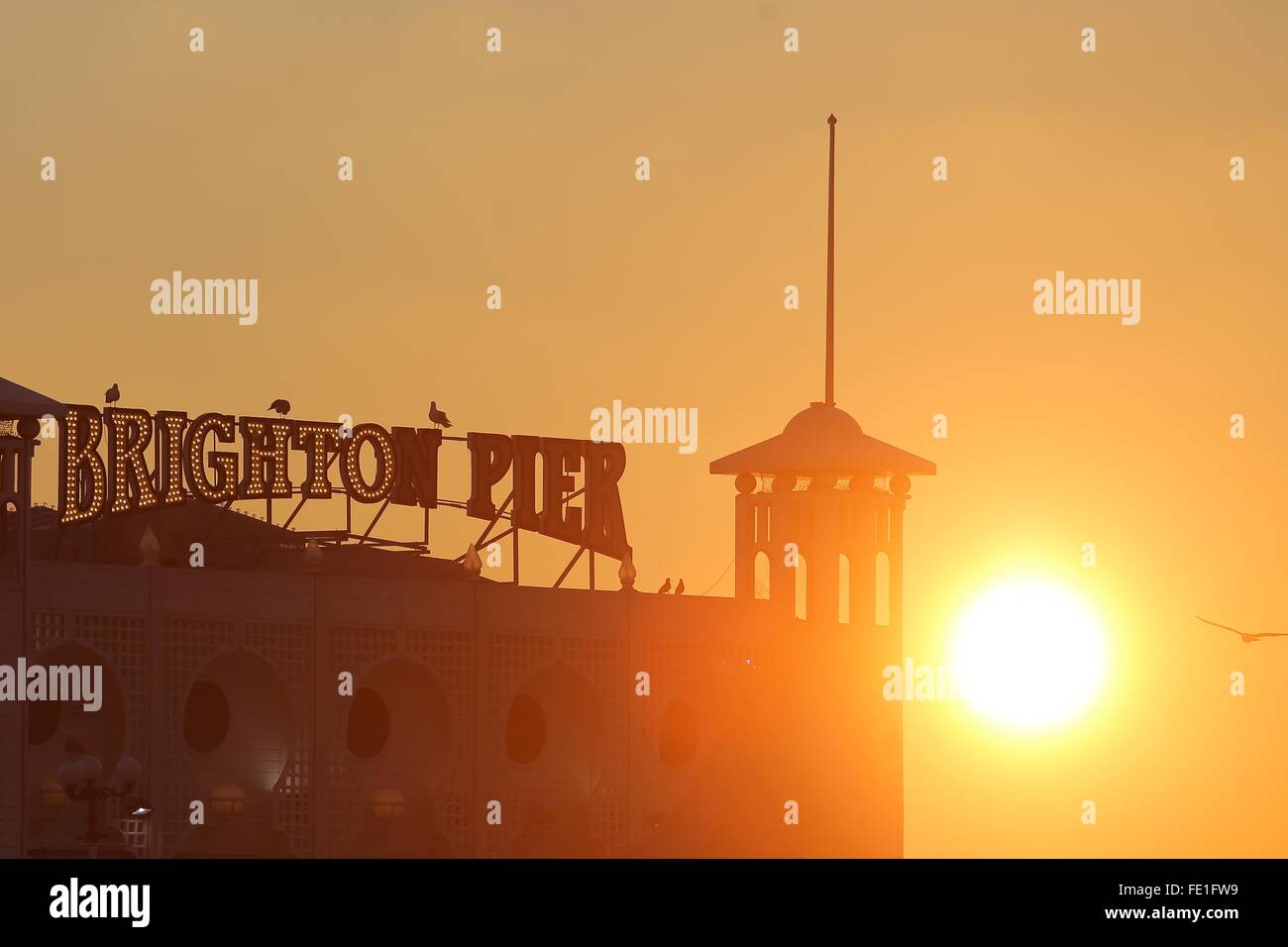 Golden sunset over Brighton Beach Stock Photo - Alamy