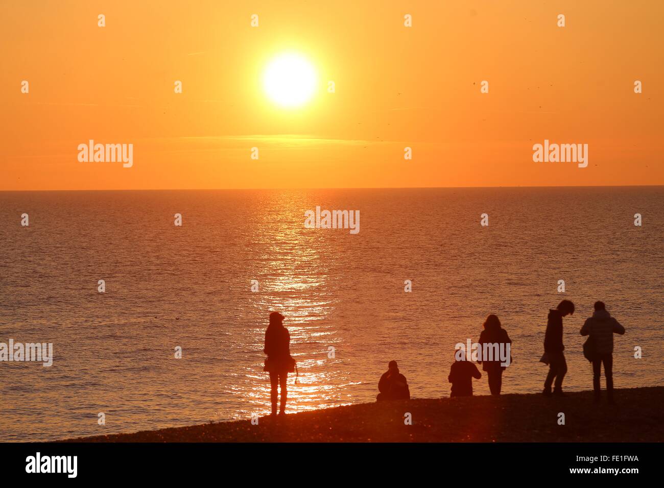 Golden sunset over Brighton Beach Stock Photo - Alamy