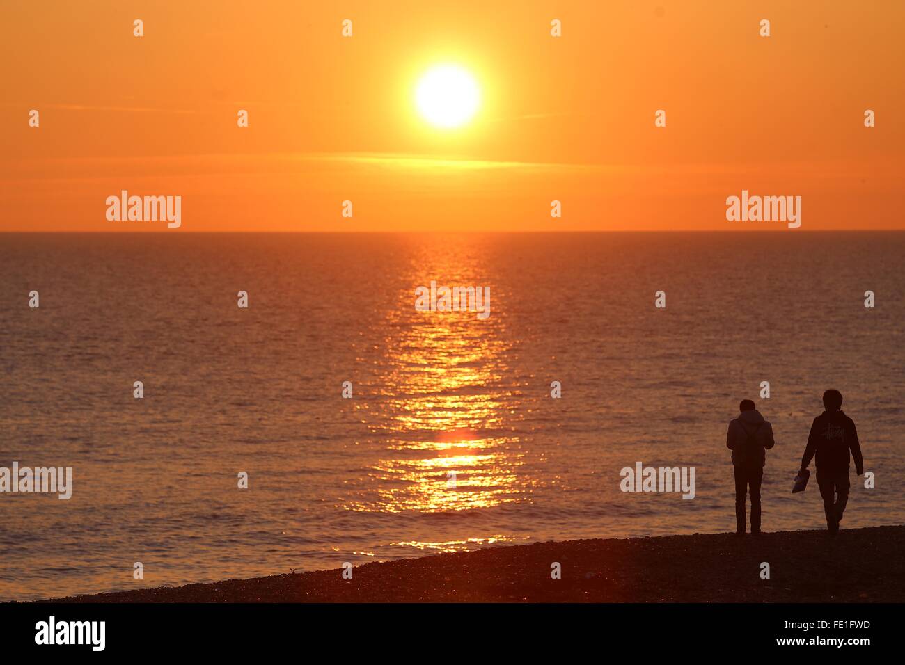 Golden sunset over Brighton Beach Stock Photo - Alamy