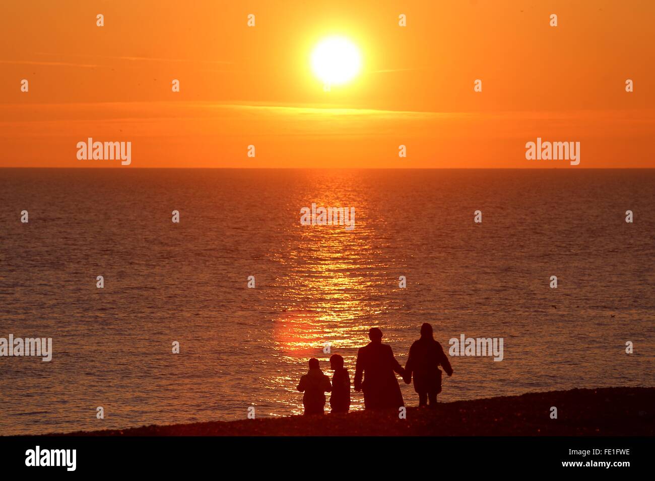 Golden sunset over Brighton Beach Stock Photo - Alamy