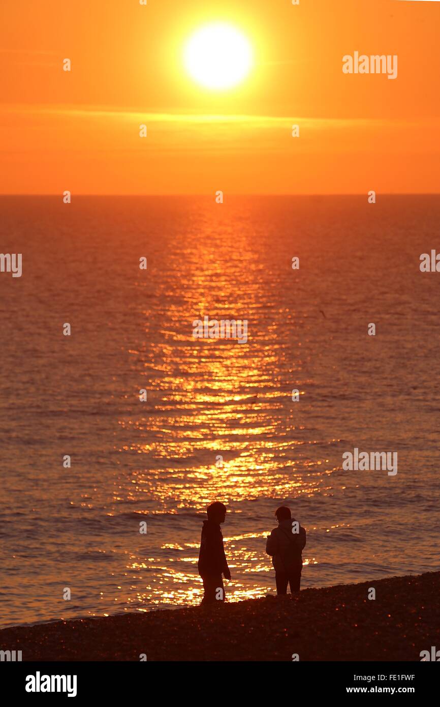 Golden sunset over Brighton Beach Stock Photo - Alamy