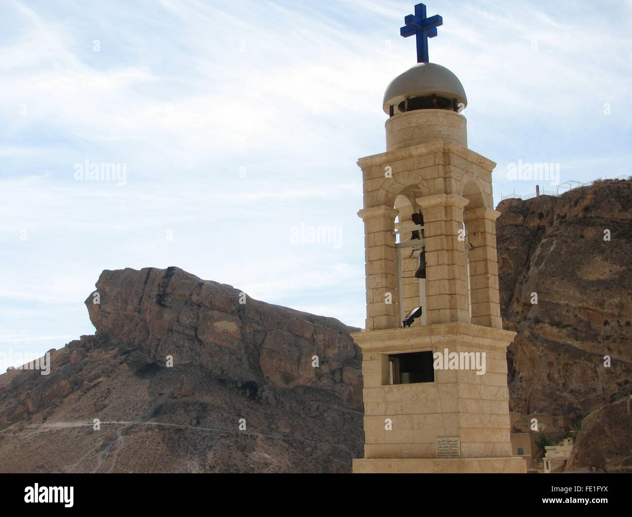 Cross at top of pillar during sunshine and nice weather at Shrine of ...