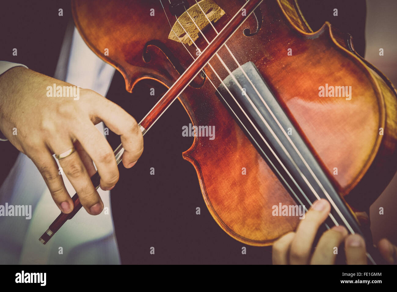 Detail of viola being played by a musician Stock Photo - Alamy