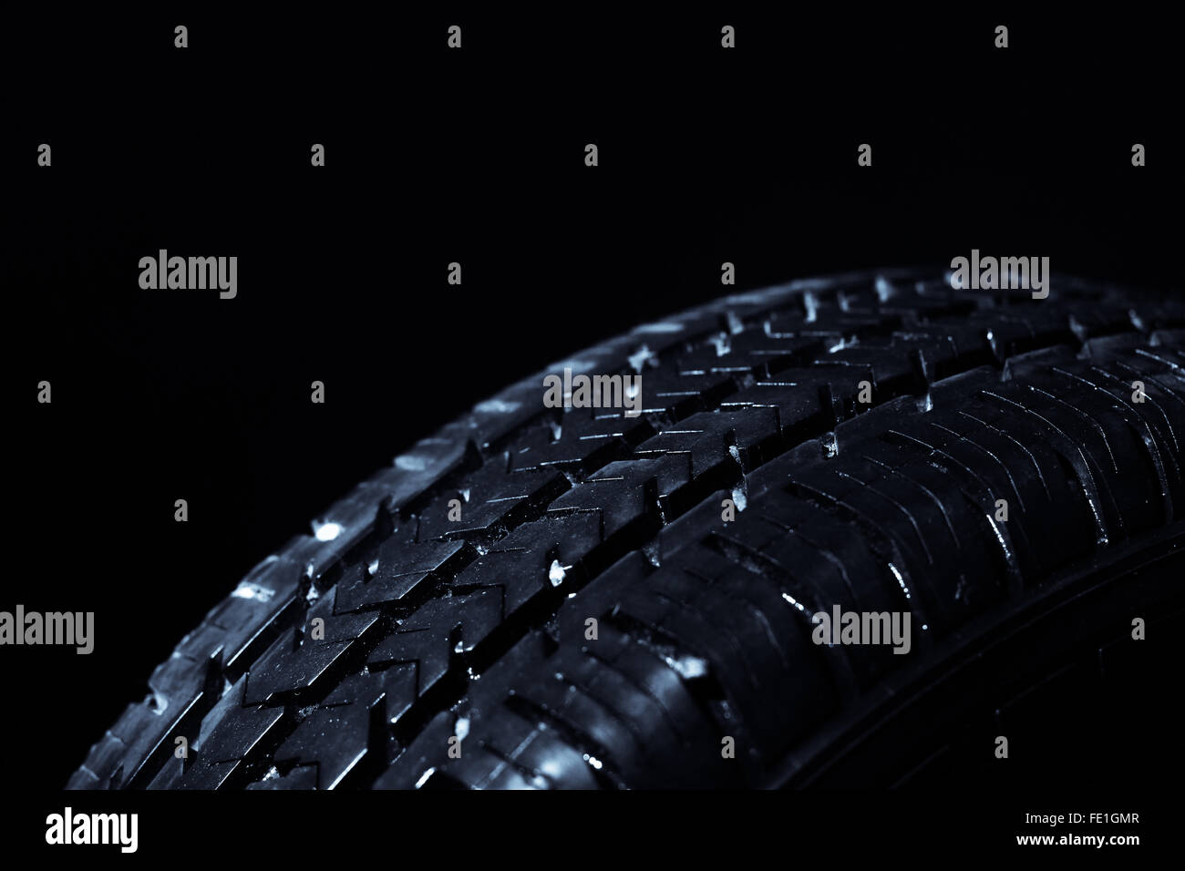 Detail of a car tire, on black Stock Photo - Alamy