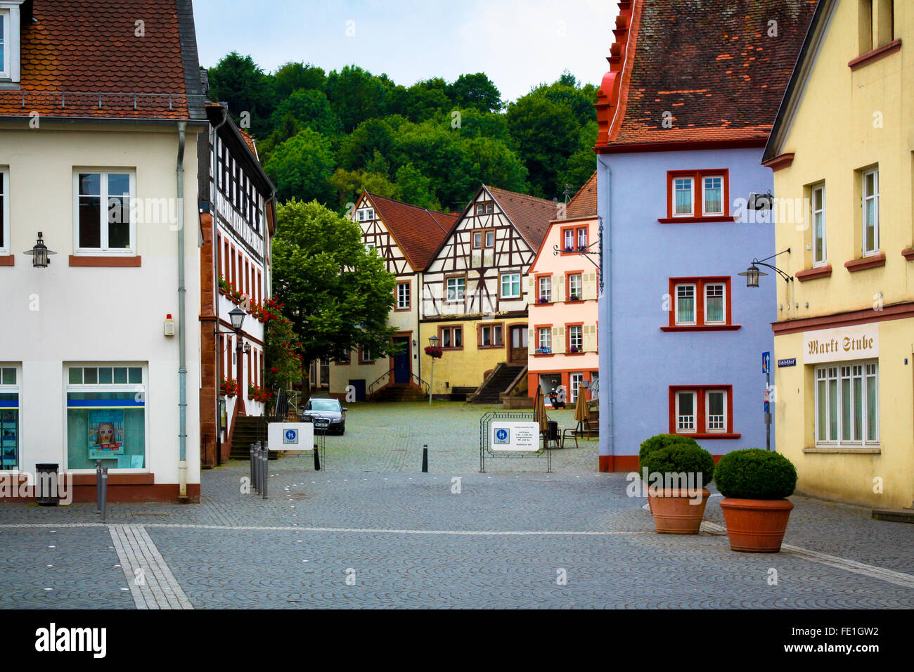 Colorful traditional German houses and empty road. Small European town ...