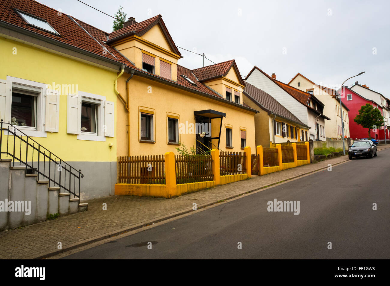 Colorful traditional German houses and empty road. Small European town ...