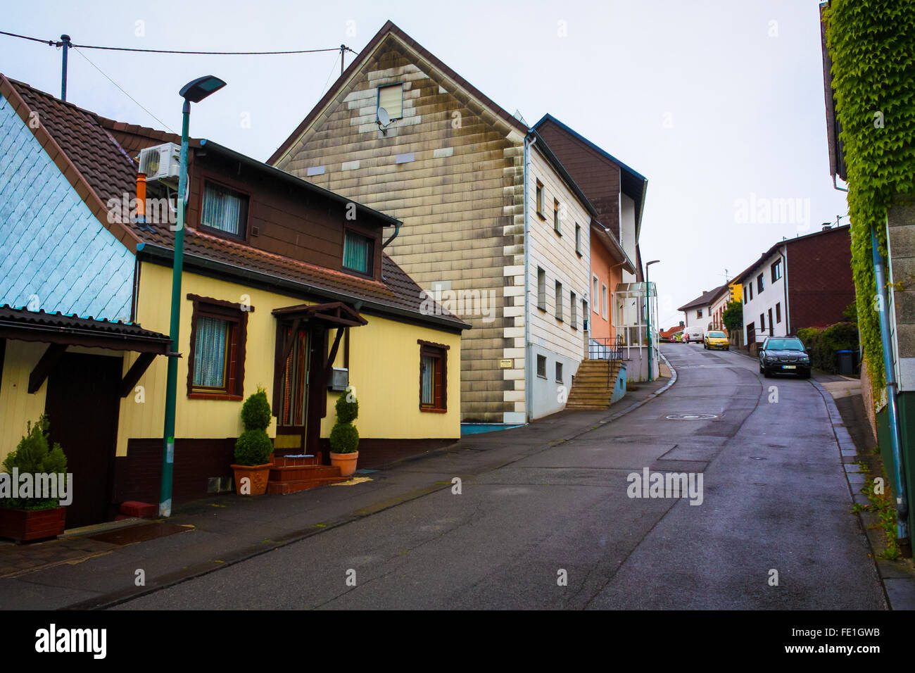 Colorful traditional German houses and empty road. Small European town ...