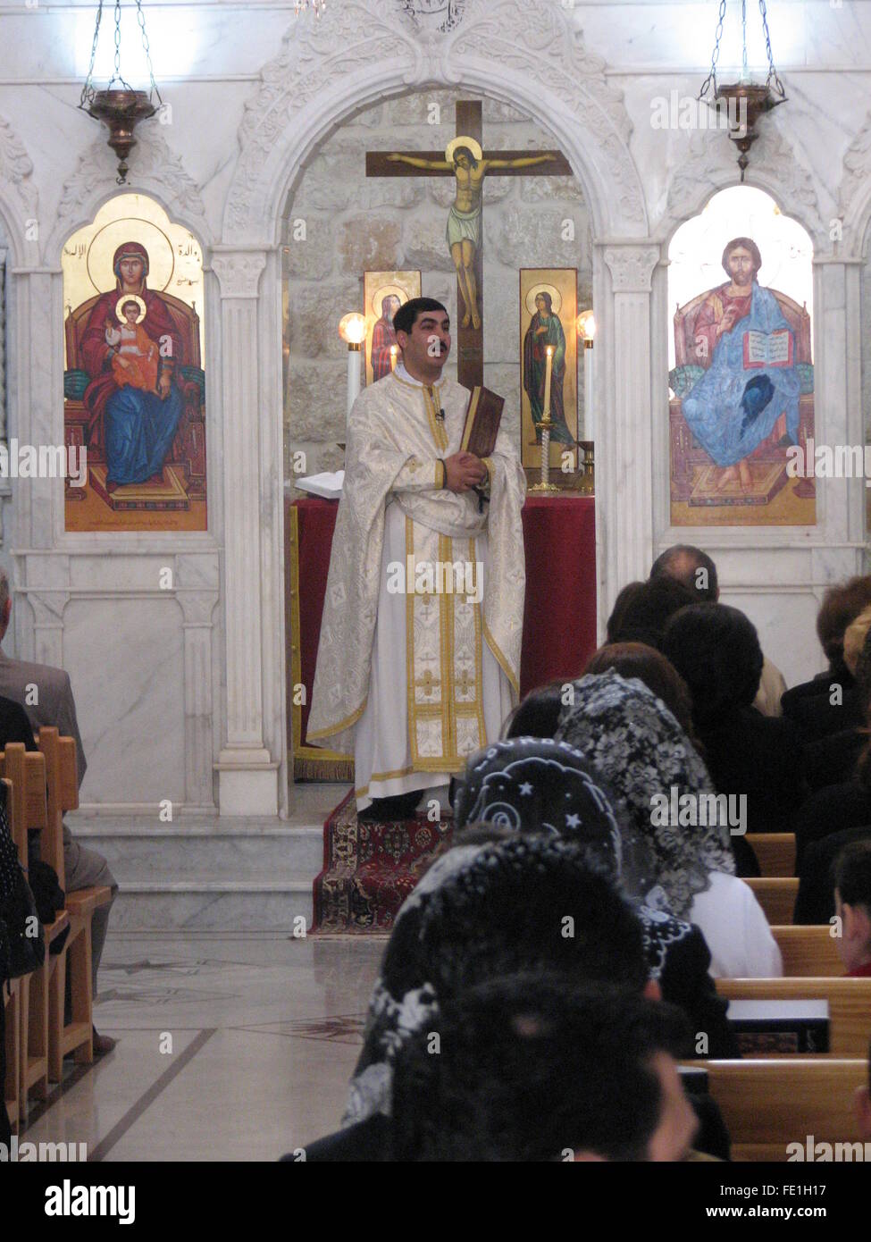 Christian Priest giving the Sunday Mass Prayer in Arabic at the Aghia ...