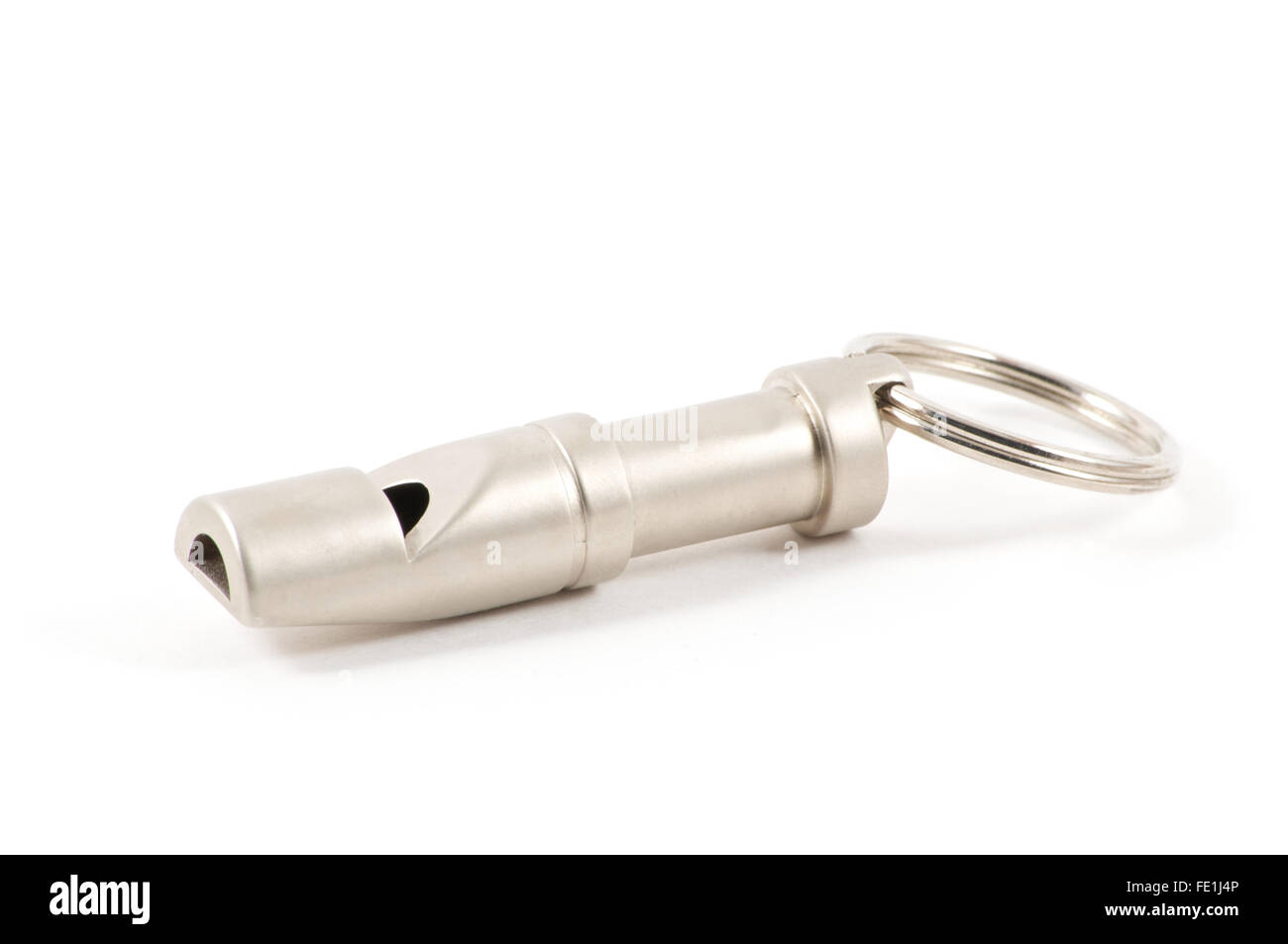 Isolated golden whistle over white background with key ring Stock Photo ...