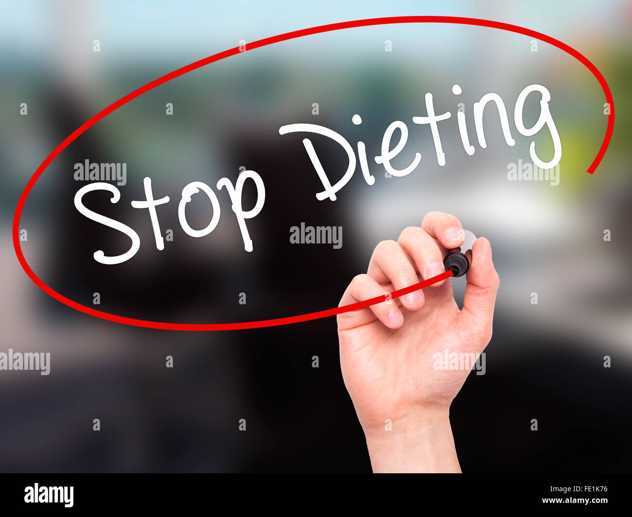Man Hand writing Stop Dieting with black marker on visual screen ...