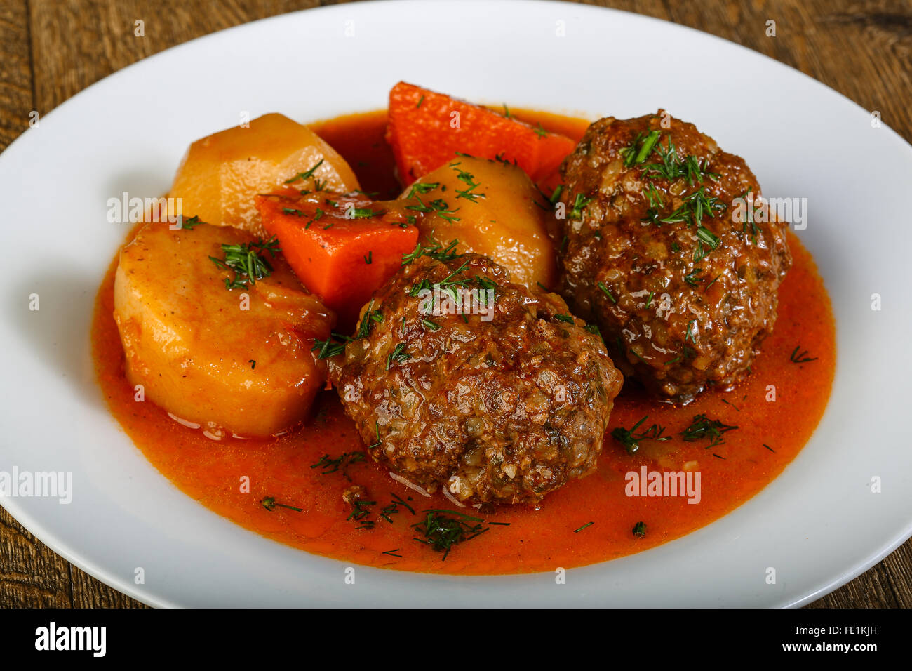 Minced meat balls with potato, carrots and sauce Stock Photo - Alamy
