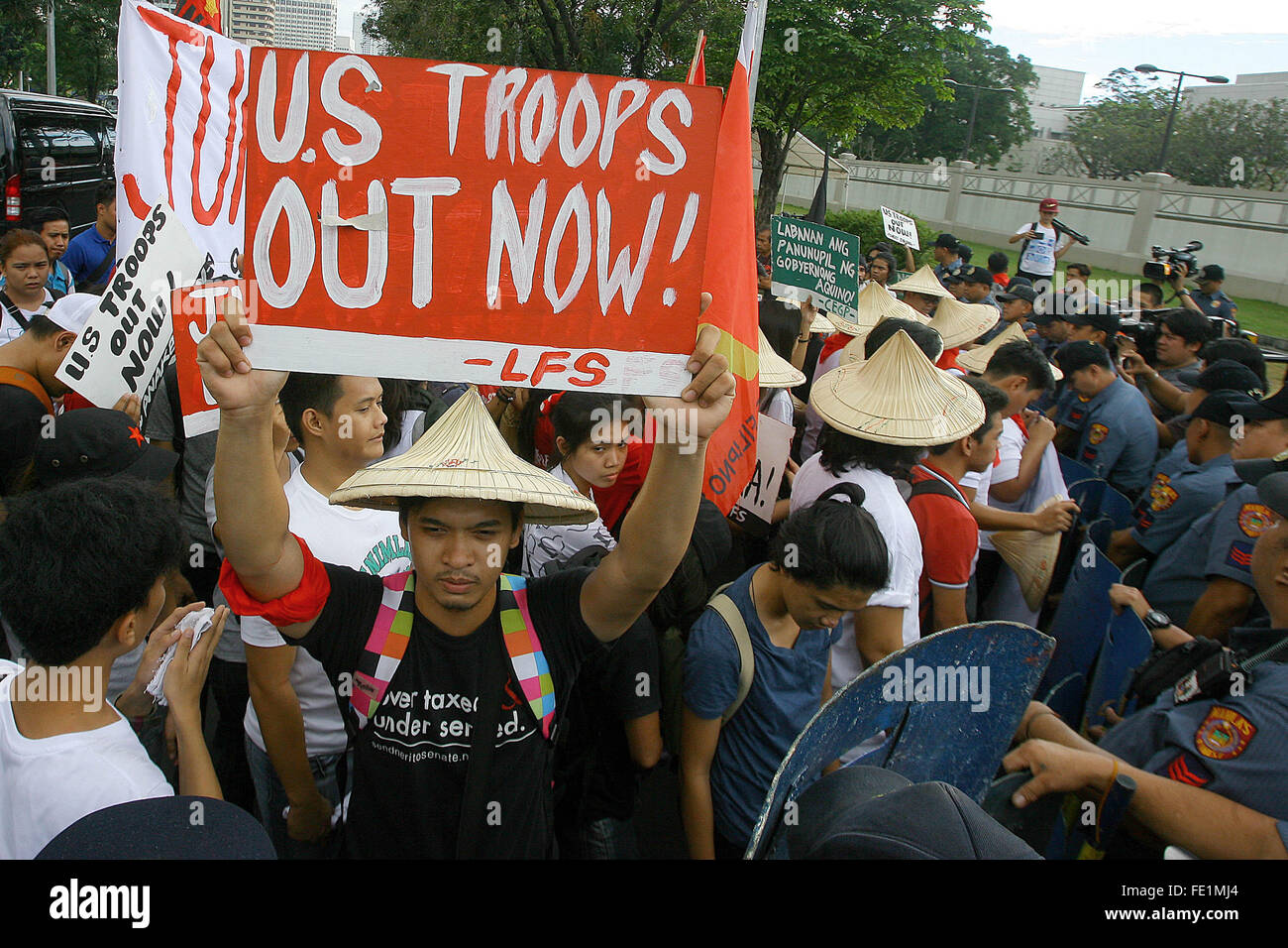 Manila, Philippines. 4th Feb, 2016. An activist holds a placard during ...