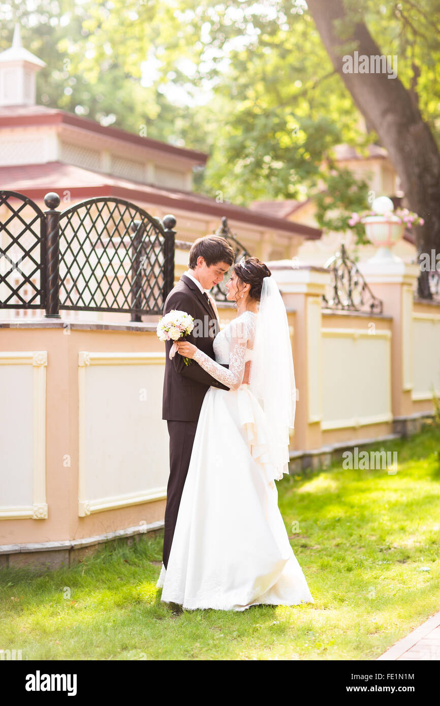 Wedding couple hugging Stock Photo - Alamy