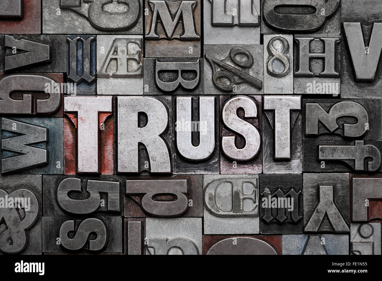 The word TRUST in old metal letterpress Stock Photo - Alamy