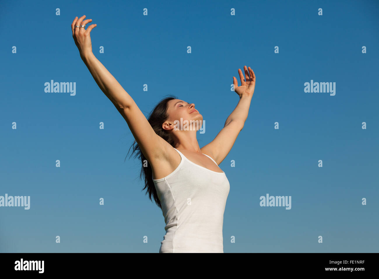 Young woman, her face upward, enjoying the sun - Stock Image Stock ...