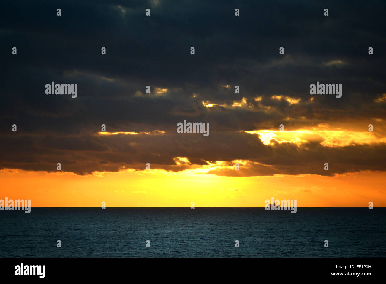 Crane ship and sunset in English Channel Stock Photo - Alamy