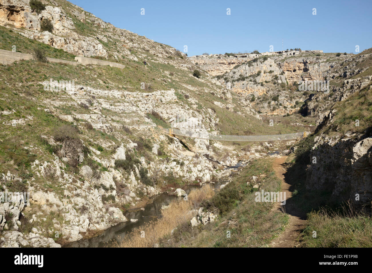 Torrente Gravina with rope bridge across river, Matera, Basilicata ...