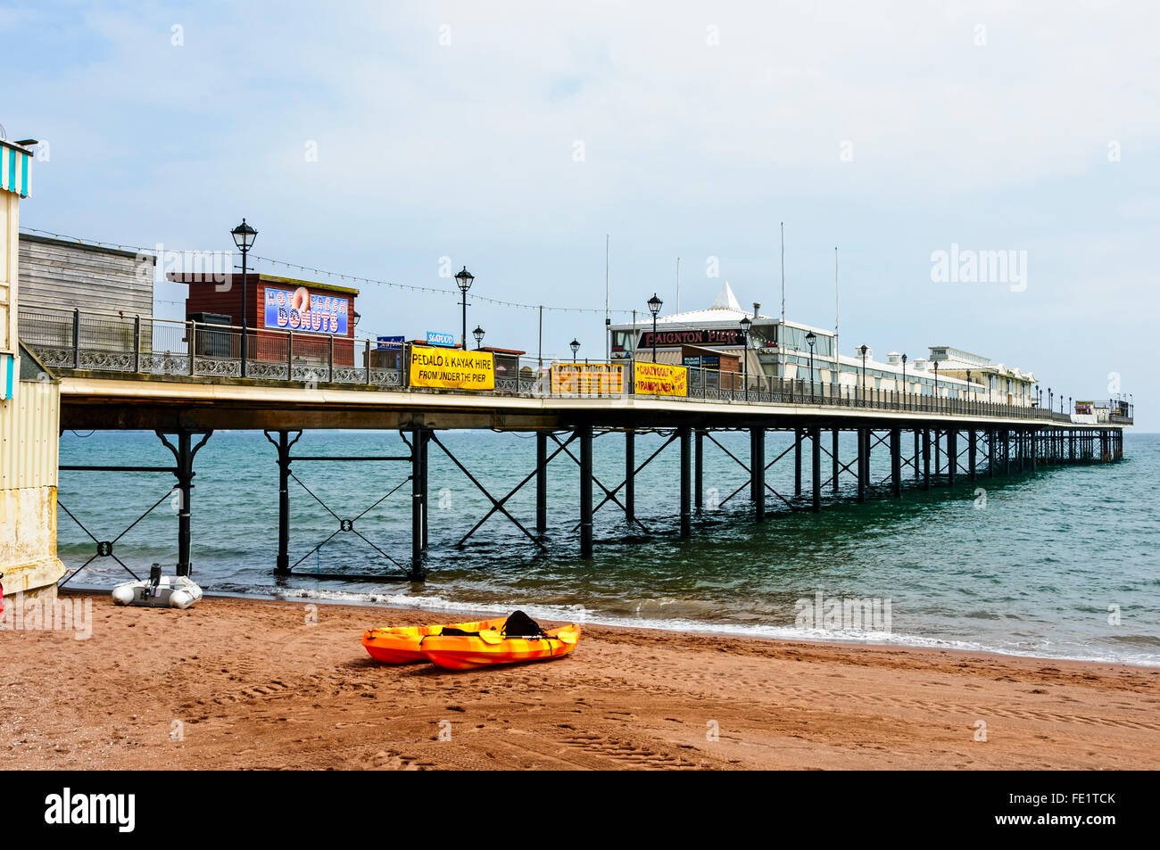 Paignton Pier reaches over a blue sea towards the horizon with cast ...