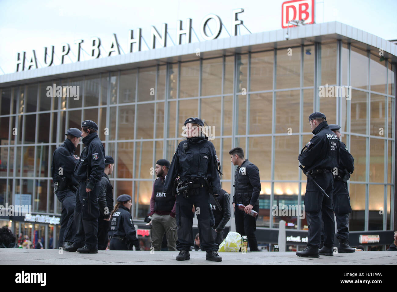 Police officers conduct spot checks near the central station in Cologne ...