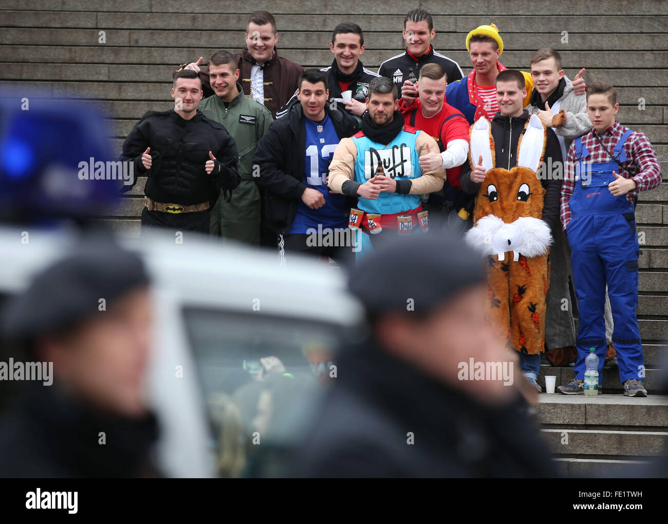 A group of cheering Carnival enthusiasts pose on the steps leading up ...