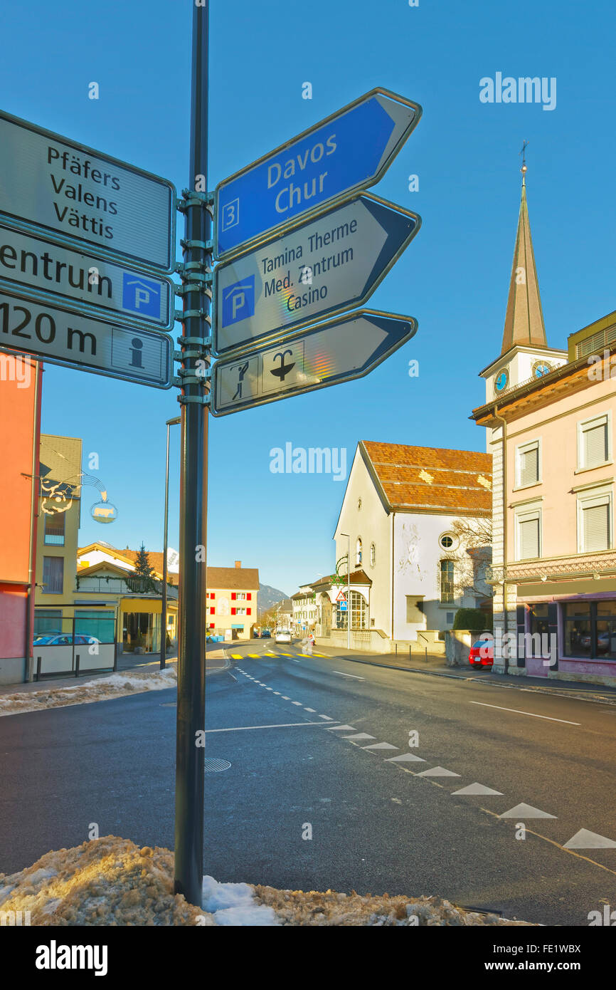 Road sign and Catholic Church in Bad Ragaz. Bad Ragaz is a city in ...