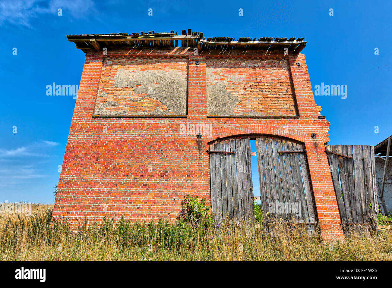 the ruin of an old barn with blue sky Stock Photo - Alamy