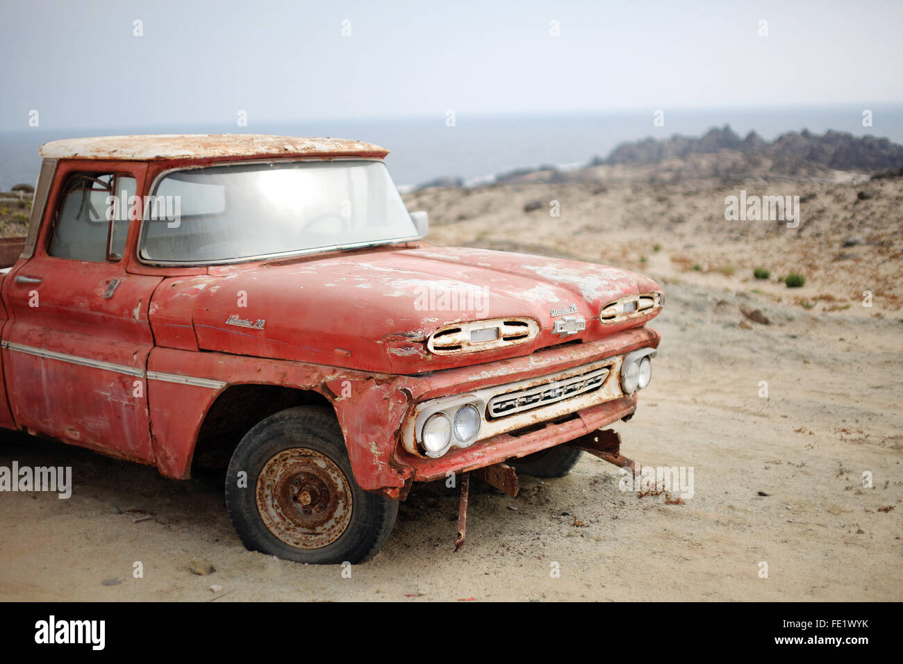 Deserted classic car near the Playa la Virgen, Atacama, region, Chile ...