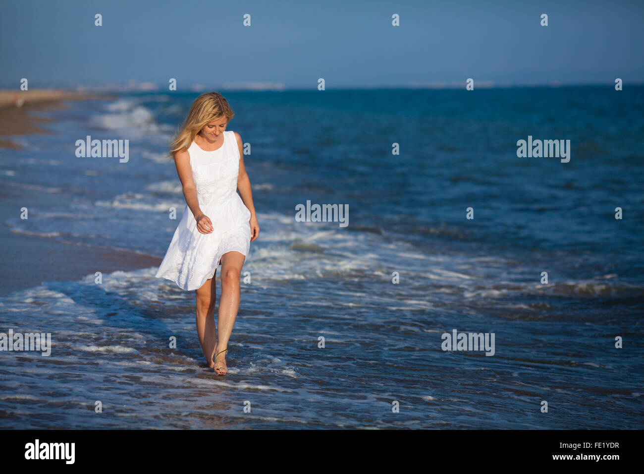 Woman walking on water Stock Photo - Alamy