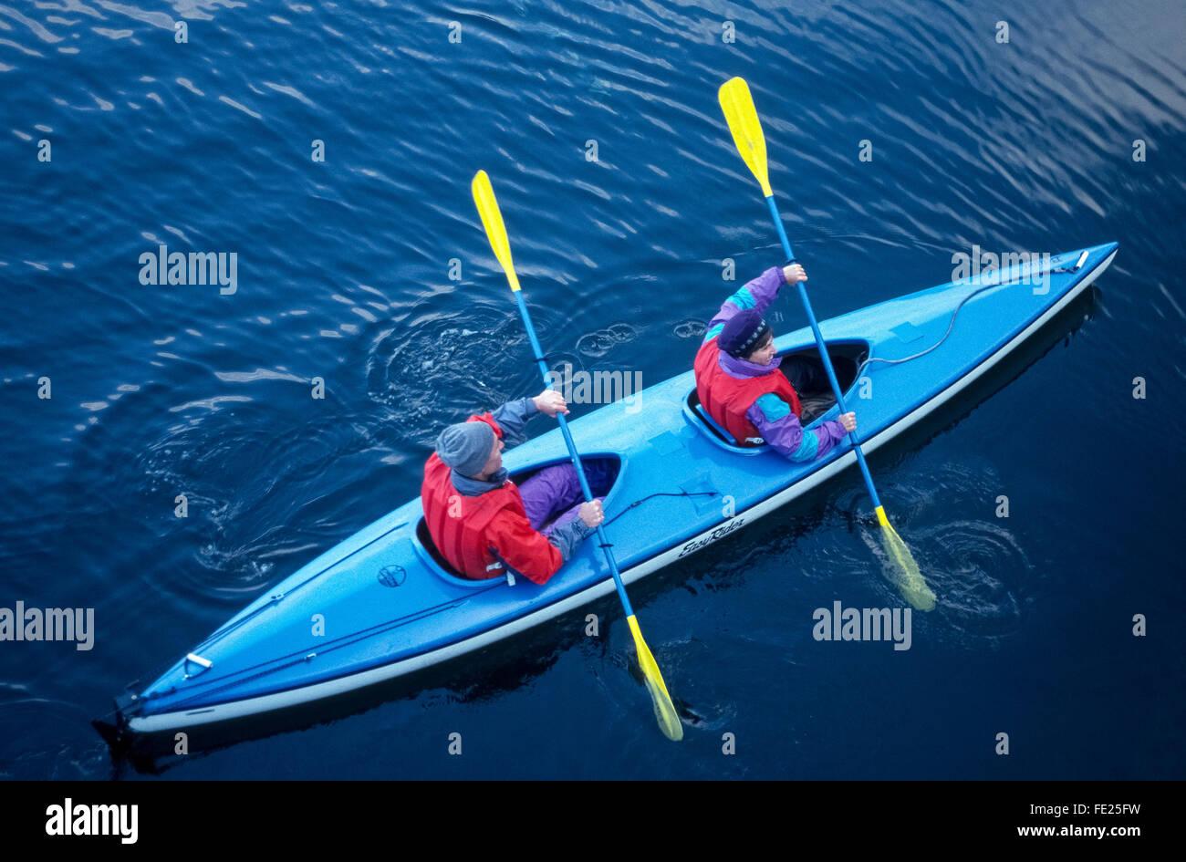 Two men paddling yellow kayaks hi-res stock photography and images - Alamy