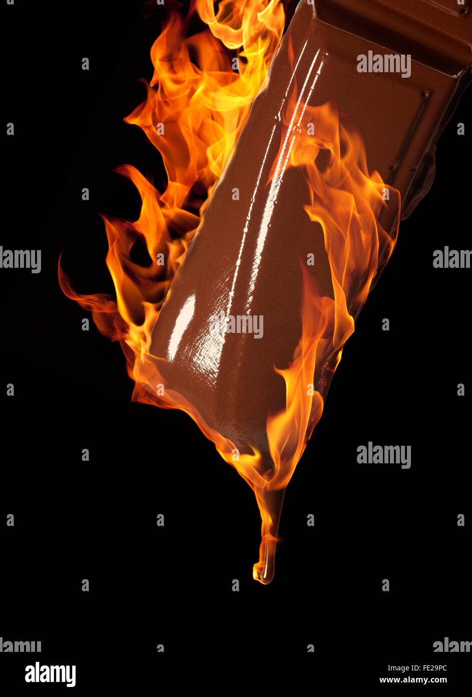 burning melting piece of chocolate in black back Stock Photo - Alamy