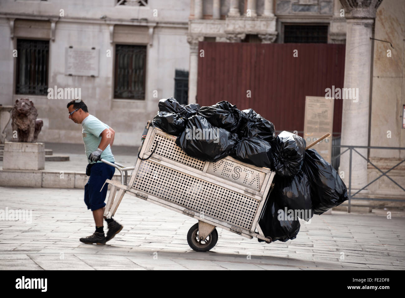 A daily early morning cleanup as a council street cleaner pulls a ...