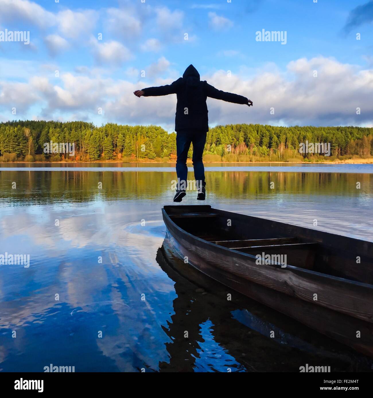 Man jumping into lake hi-res stock photography and images - Alamy