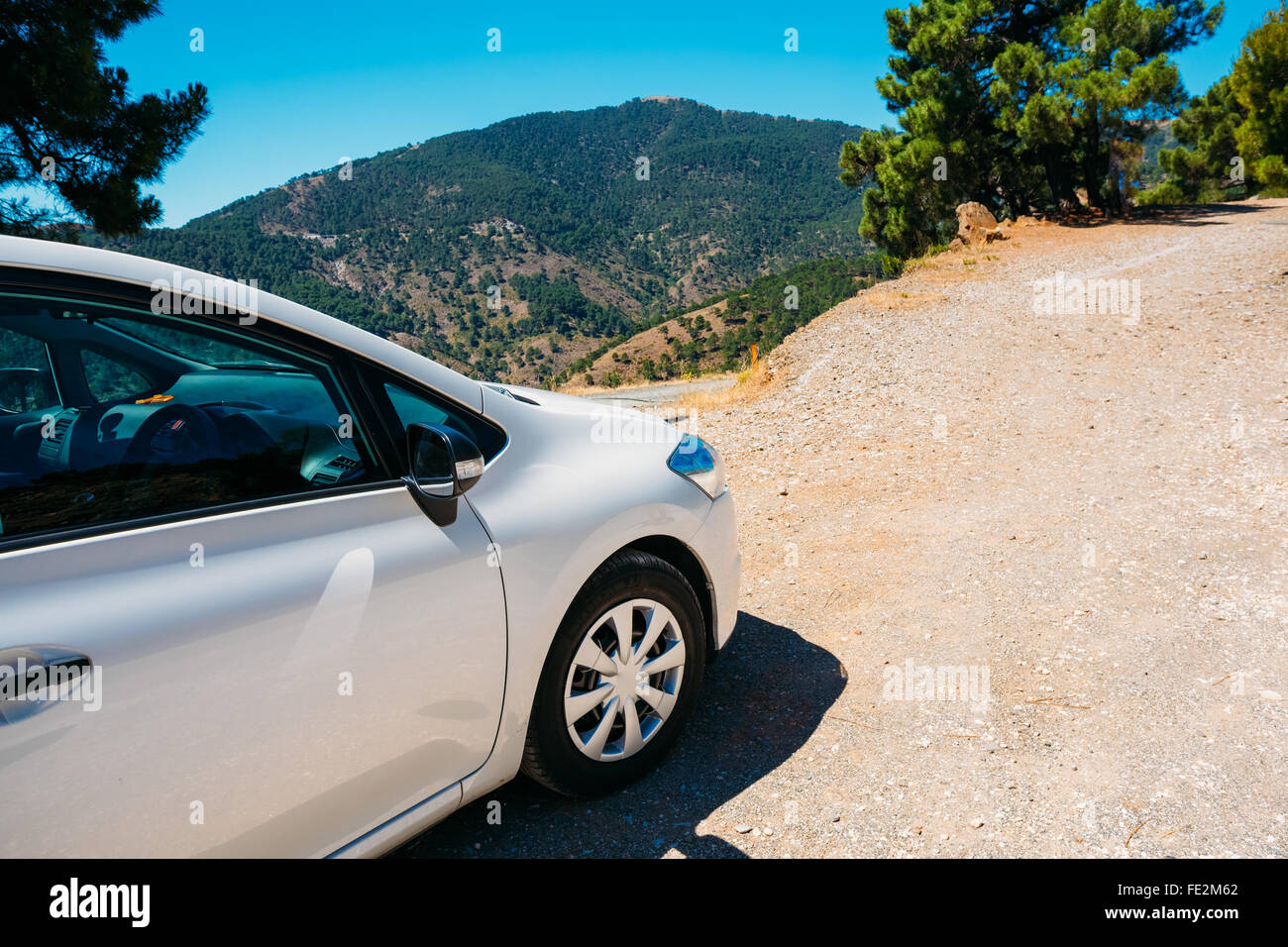 One small hatchback car on a white background summer beautiful Spanish ...
