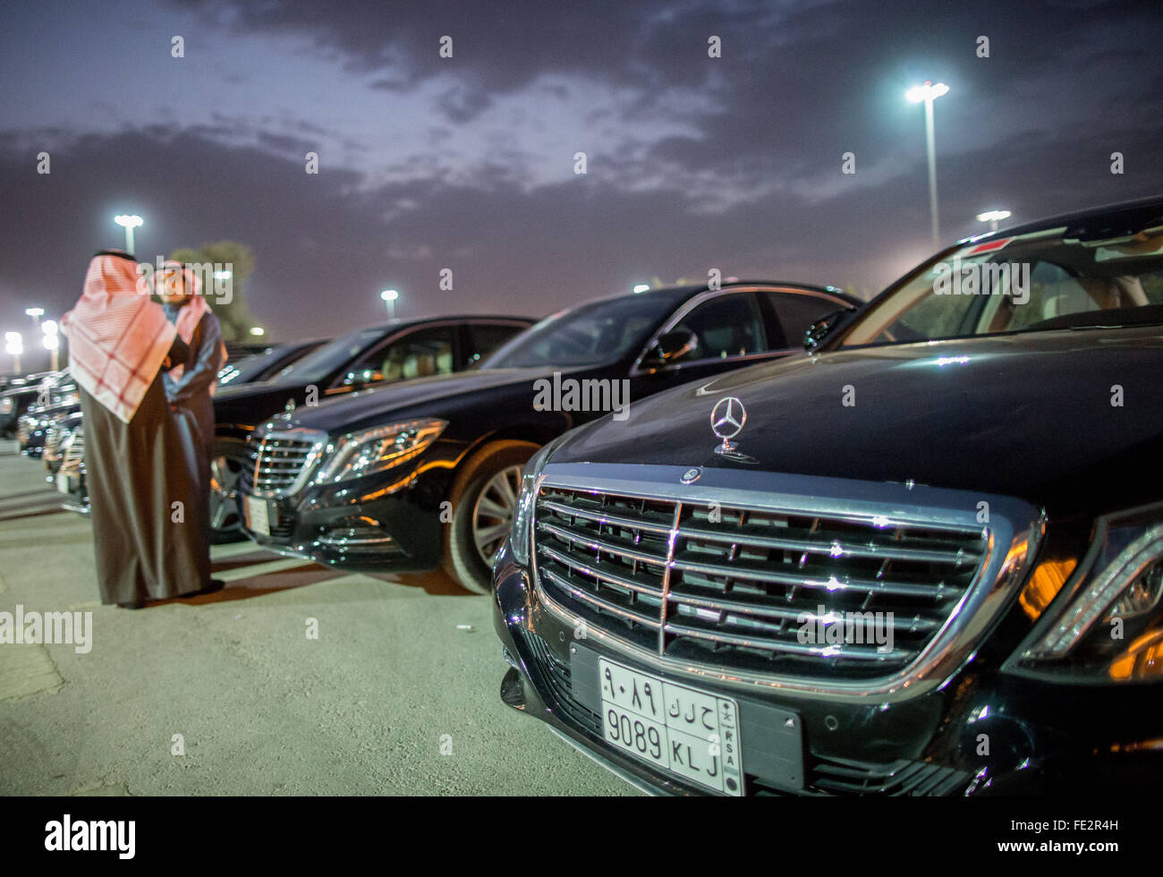 People stand in front of their Mercedes cars at the Al-Jenadriyah ...