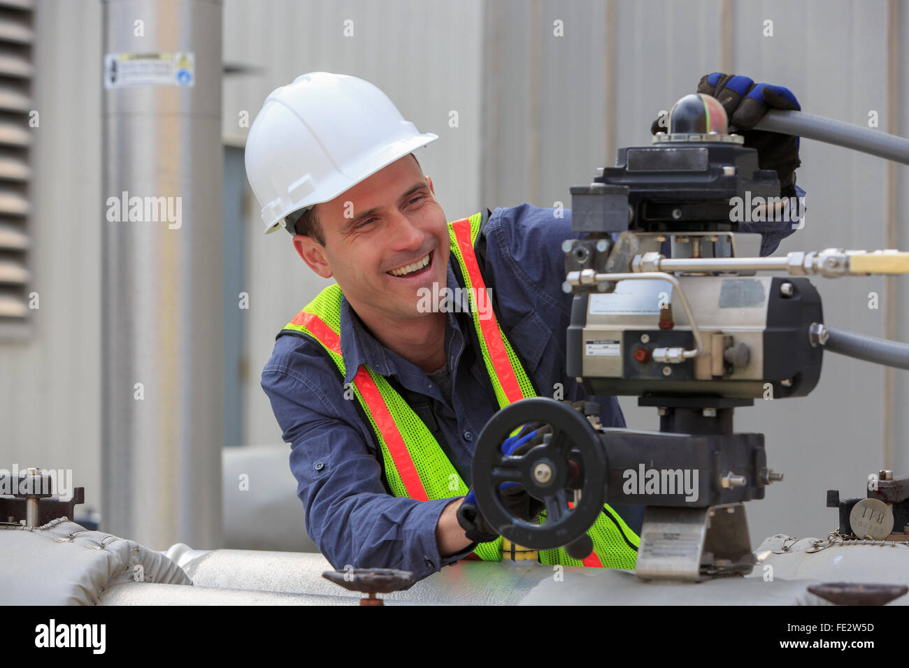 Industrial engineer working on a hydraulic pump at a power plant Stock ...