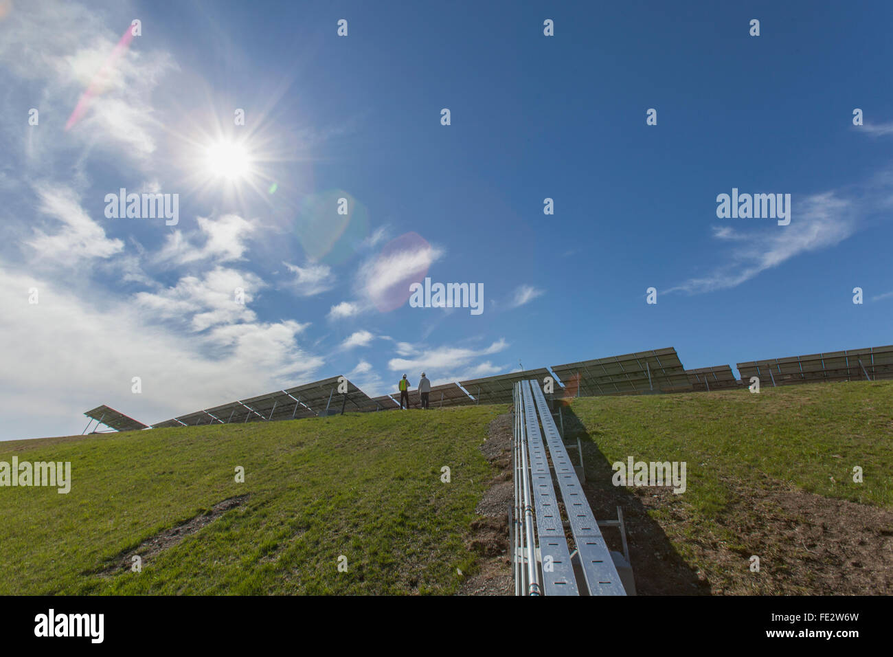 Power engineers standing in front of solar photovoltaic array Stock ...