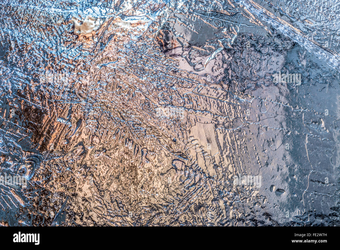 Through a transparent and melting layer of ice Stock Photo - Alamy