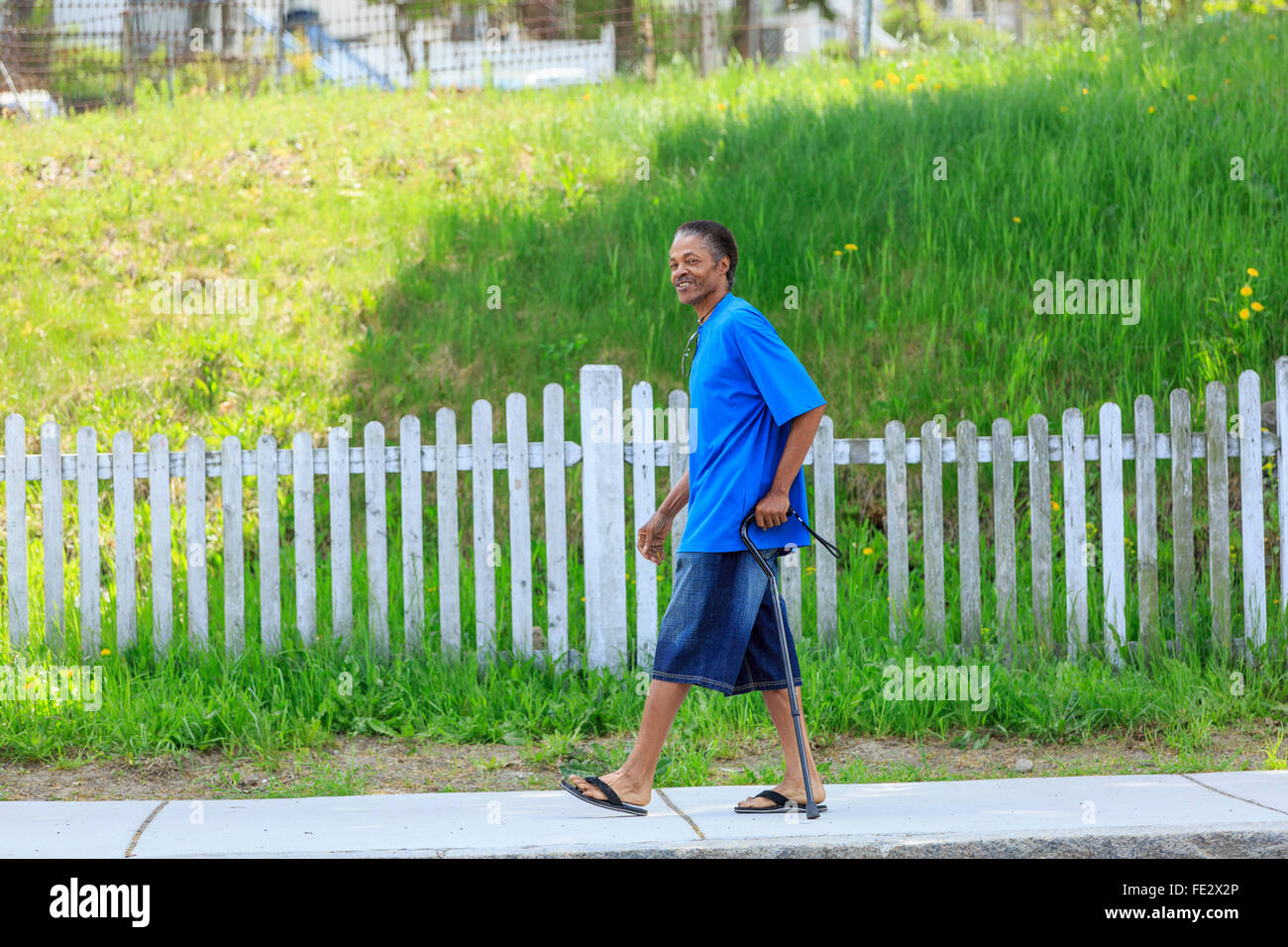 Man with Traumatic Brain Injury relaxing with his cane in his ...